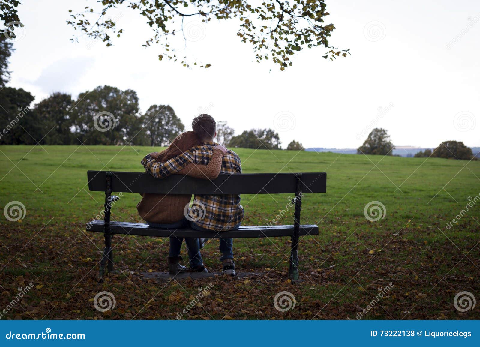 Cuddle in the Park stock photo. Image of grass, women - 73222138