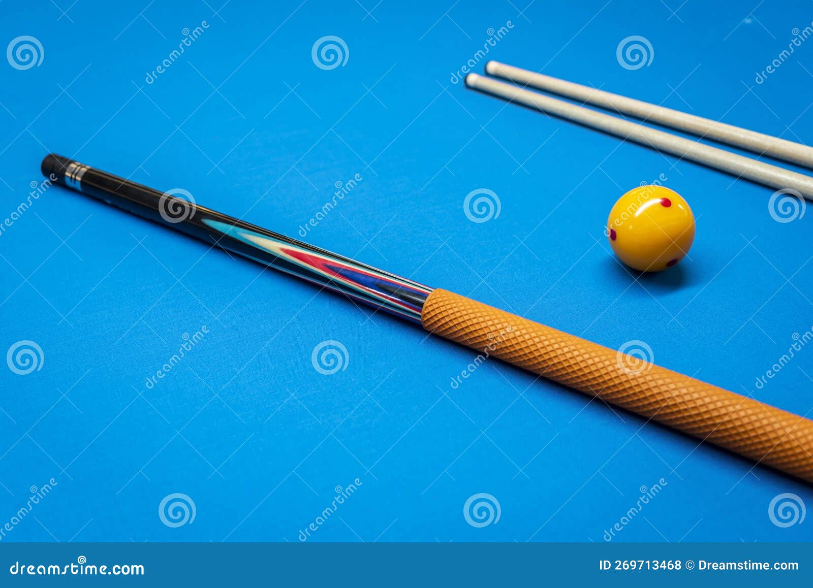 Cue Sticks and a Yellow Ball on a Billiard Table Stock Photo - Image of ...