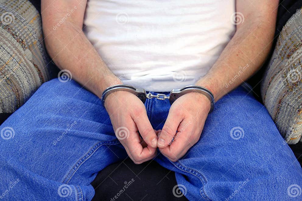 Cuffed. stock photo. Image of trial, caught, police, crime - 1477010