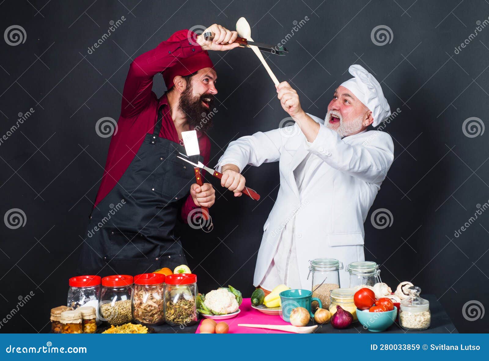 Culinary Battle of Professional Chef. Two Chefs in Uniform on Kitchen ...