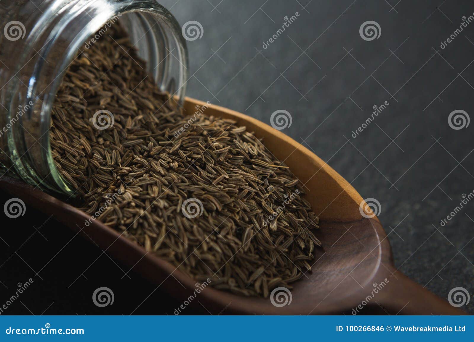 Cumin Spilling Out of Jar into Scoop Stock Photo - Image of scoop ...