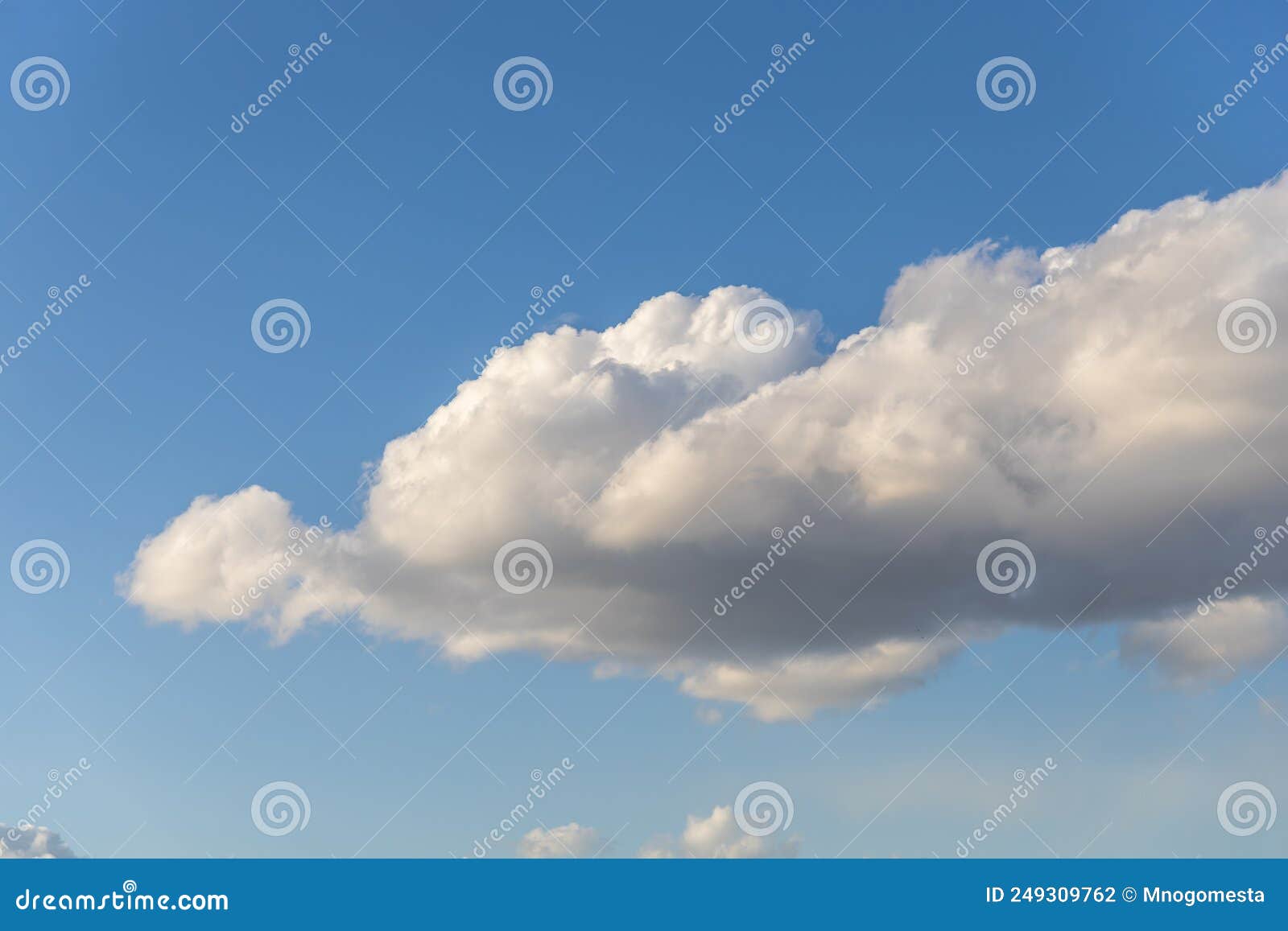 A Cumulus Cloud Against a Clear Blue Sky Stock Photo - Image of ...