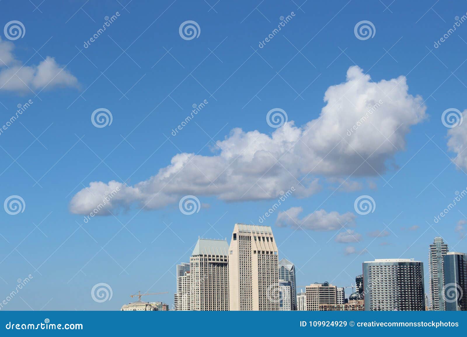 Cumulus Clouds Above High-rise Building Picture. Image: 109924929