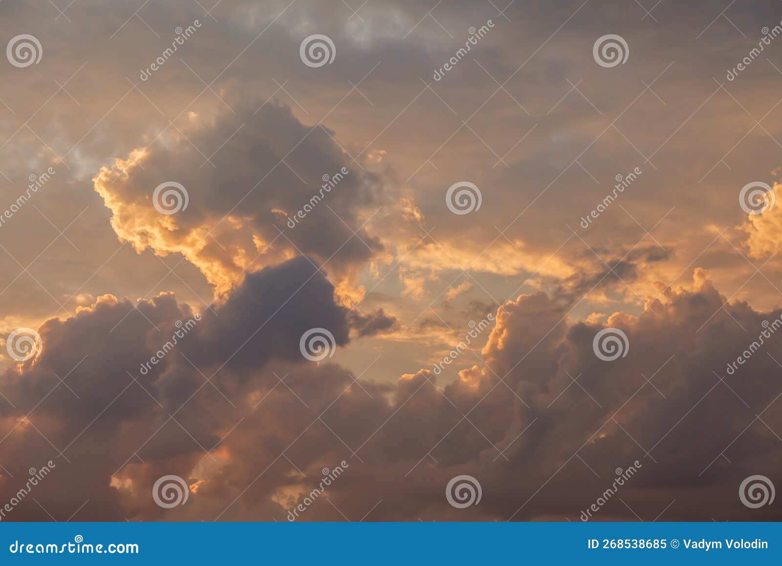 Cumulus clouds at sunset stock image. Image of storm - 268538685