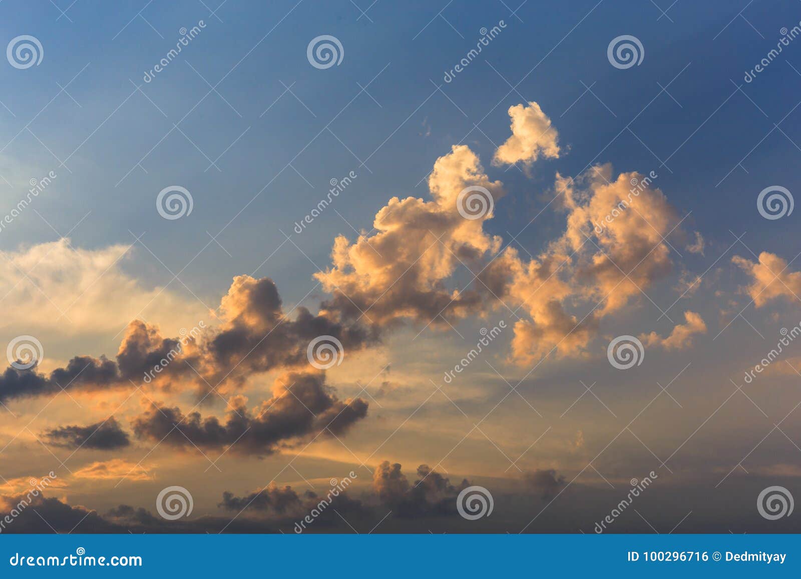 Cumulus Sunset Clouds with Sun Setting Down Stock Photo - Image of ...