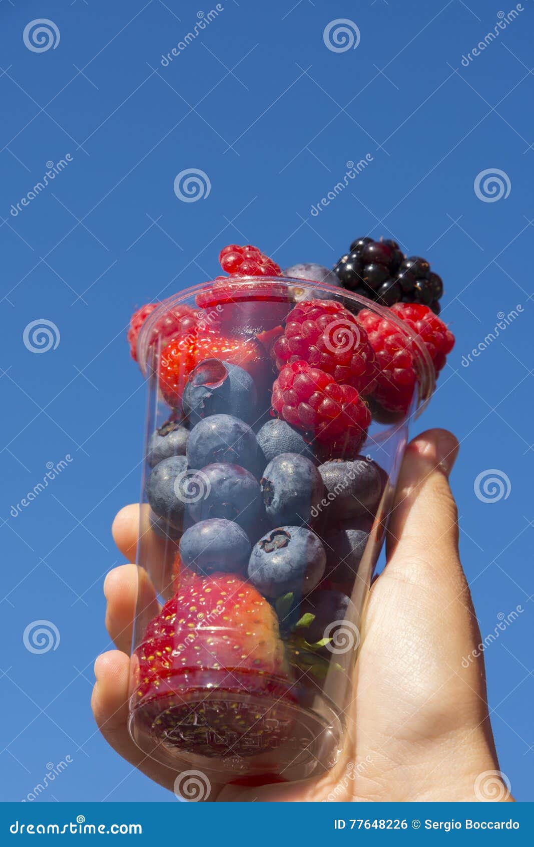 Cup of berries stock photo. Image of fruit, child, glass - 77648226