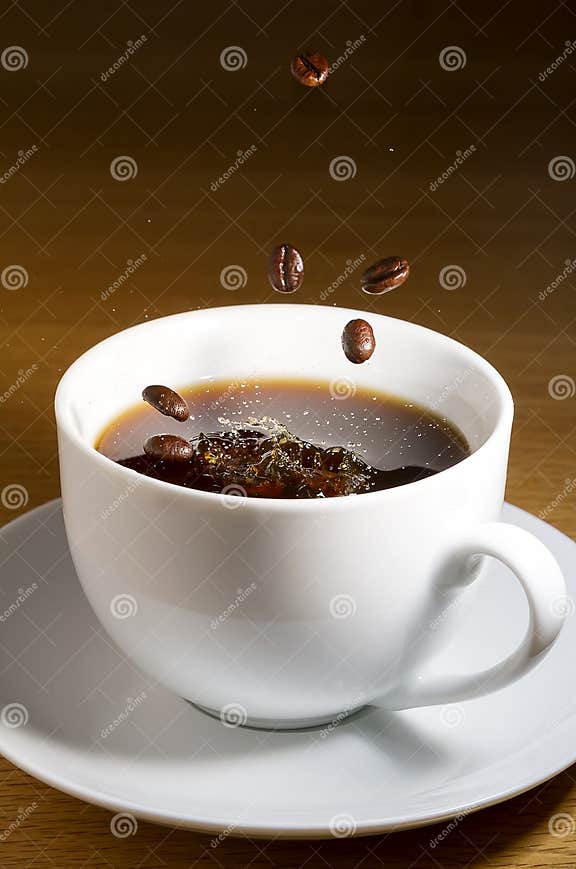 Cup of Black Coffee with Beans Dropping Stock Photo - Image of arabica ...