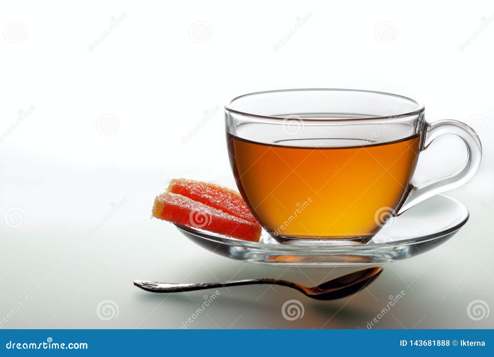 A Cup of Black Tea and a Spoon on a White Table with Reflection Stock ...