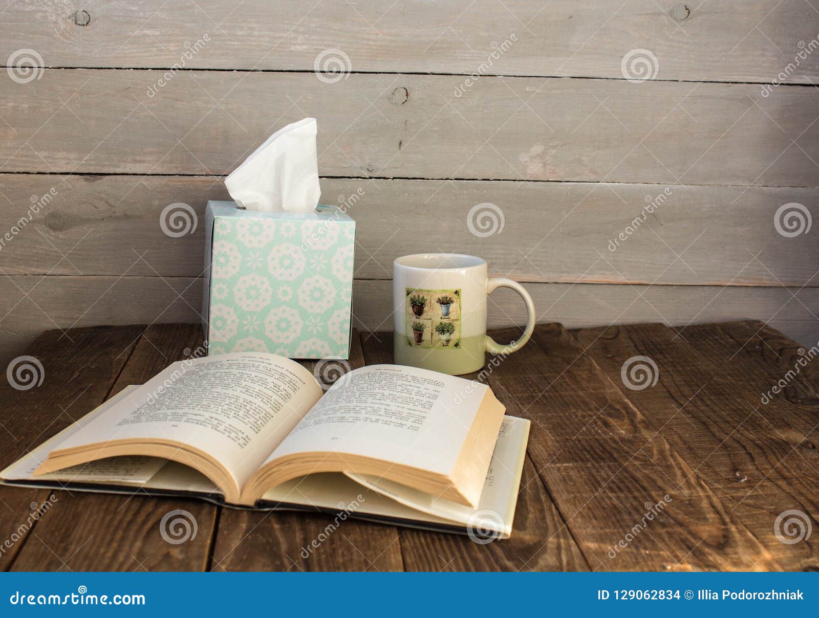 A Cup with Cafe an Open Book and a Box with Napkins Stock Photo - Image ...
