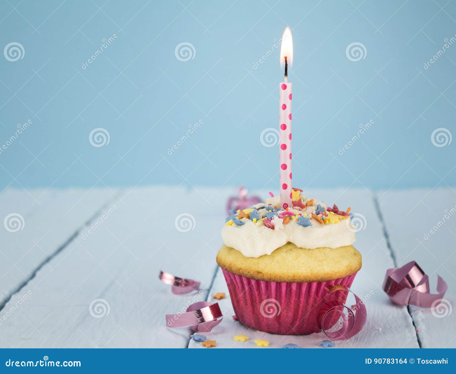 Cup Cake with One Candle on Blue Background Stock Photo - Image of ...
