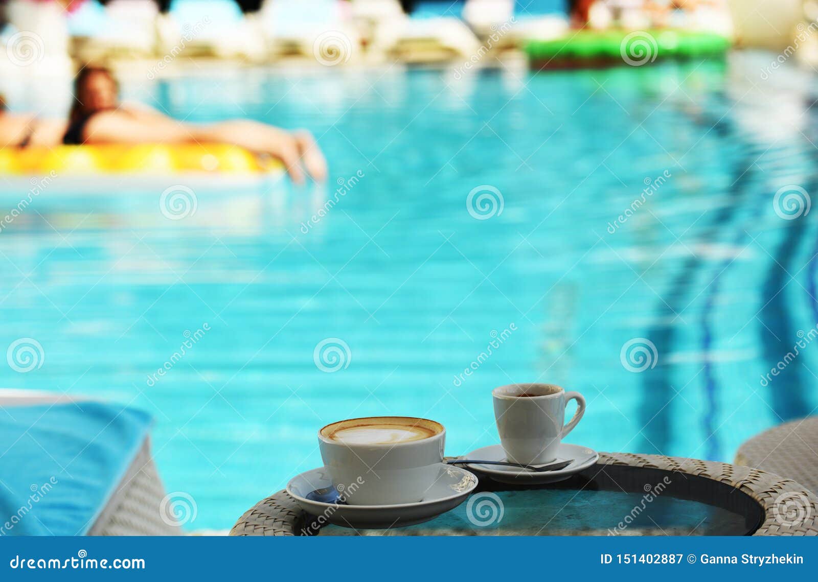 A Cup of Cappuccino and Coffee on the Background of Emerald Pool Water ...