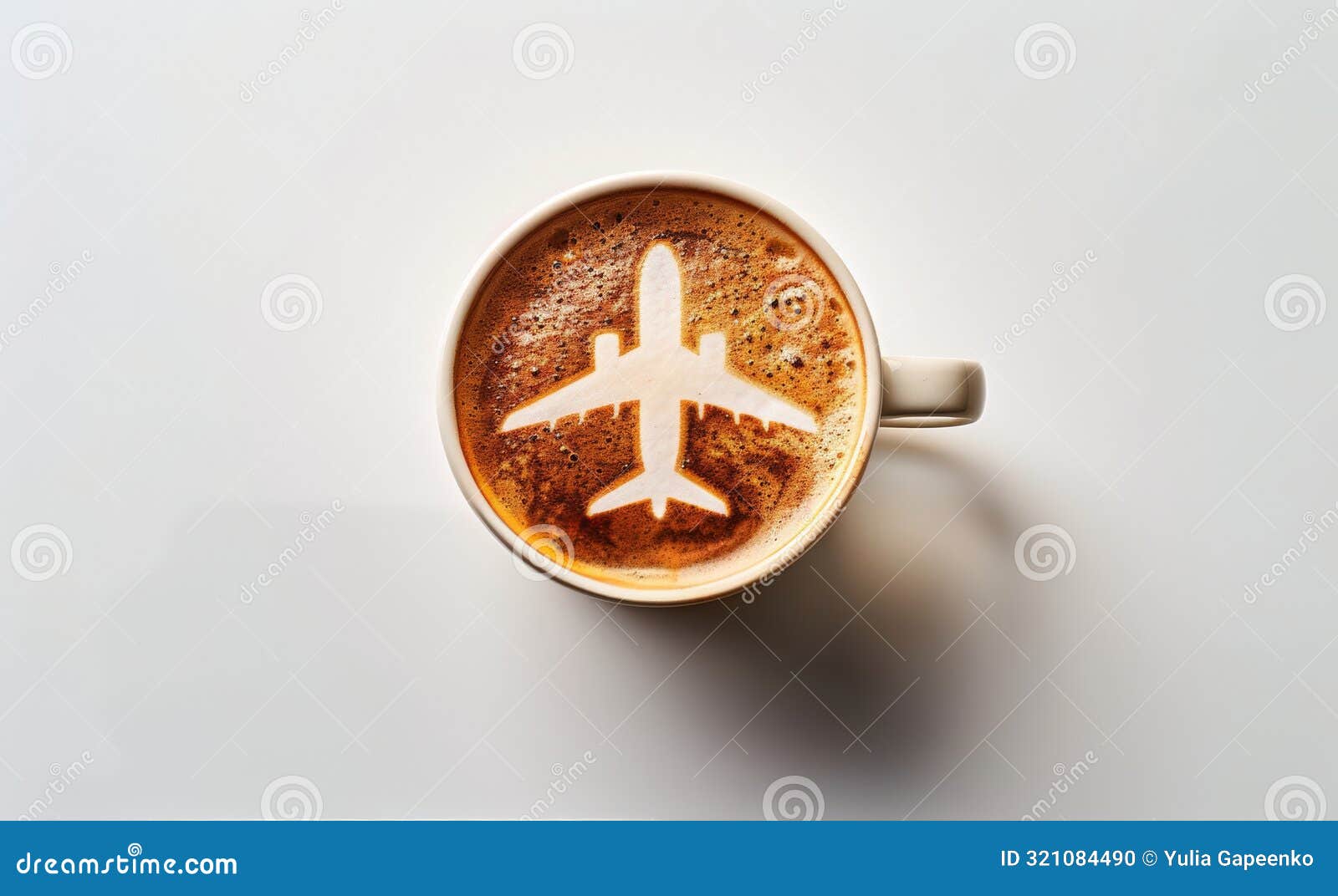 A Cup of Coffee with an Airplane Design in the Foam Surrounded by ...