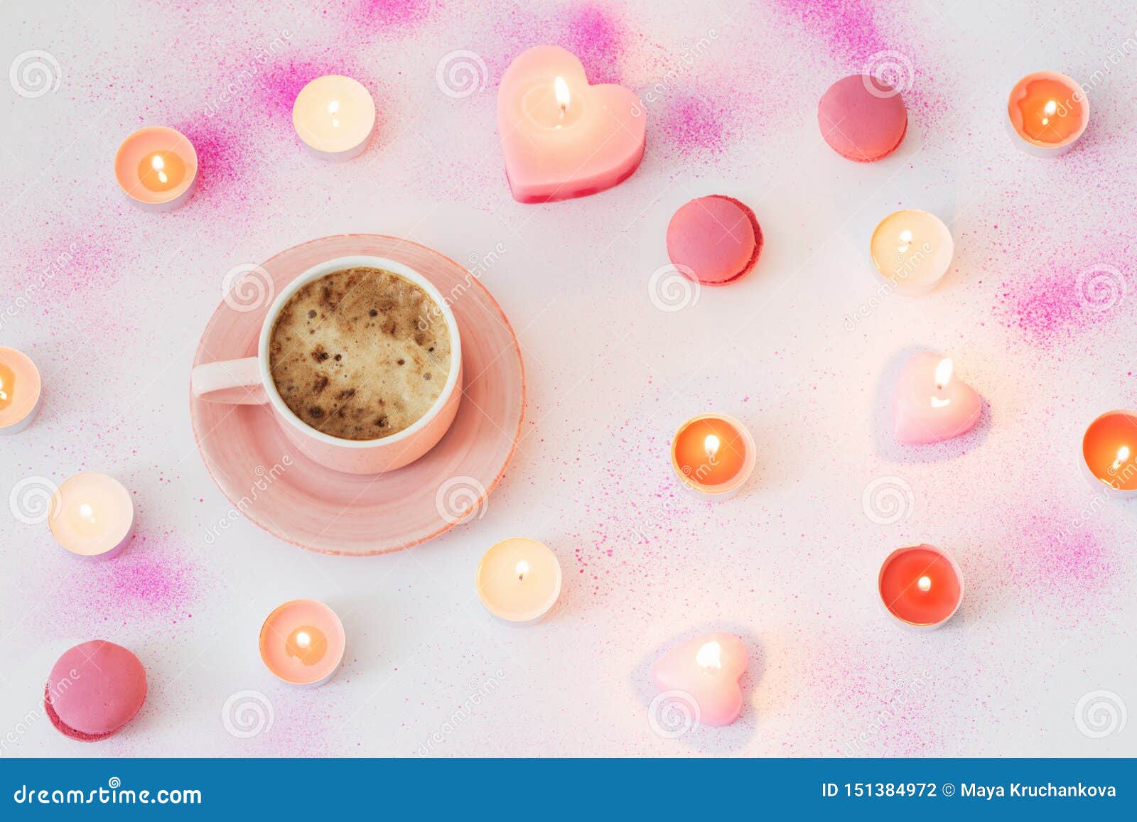 Cup of Coffee with Burning Candles on Pink Paper Background Stock Photo ...