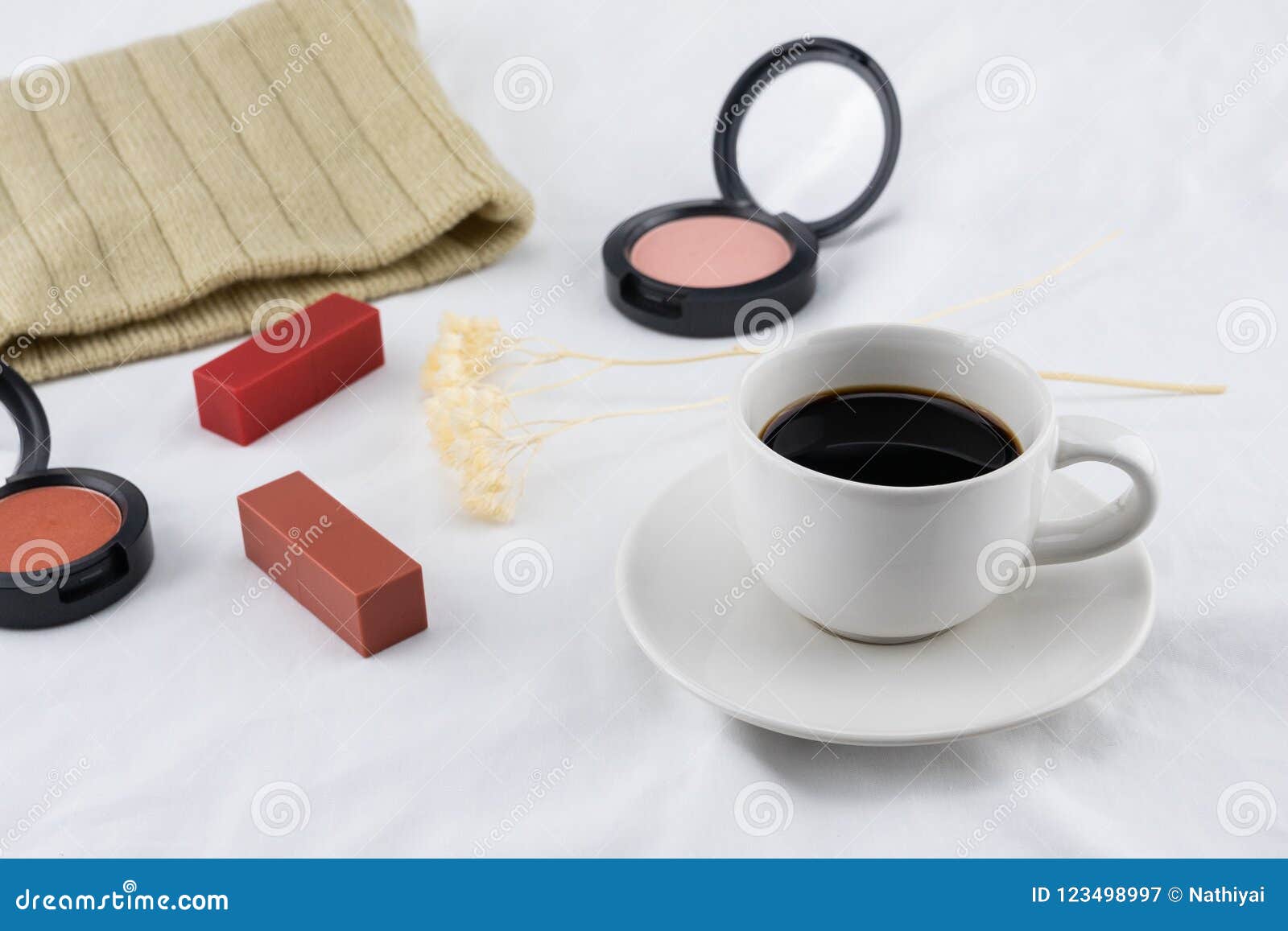 A Cup of Coffee with Cosmetics on White Bed Stock Image - Image of ...