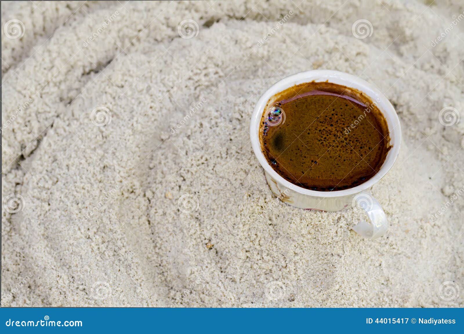 Cup With Coffee Costs On Sand Stock Photo - Image: 44015417