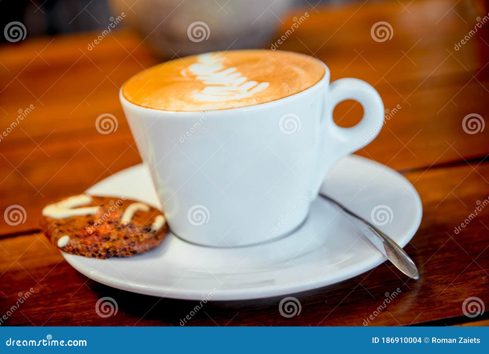 Cup of Coffee with Foam and Biscuits on the Table. Stock Photo - Image ...
