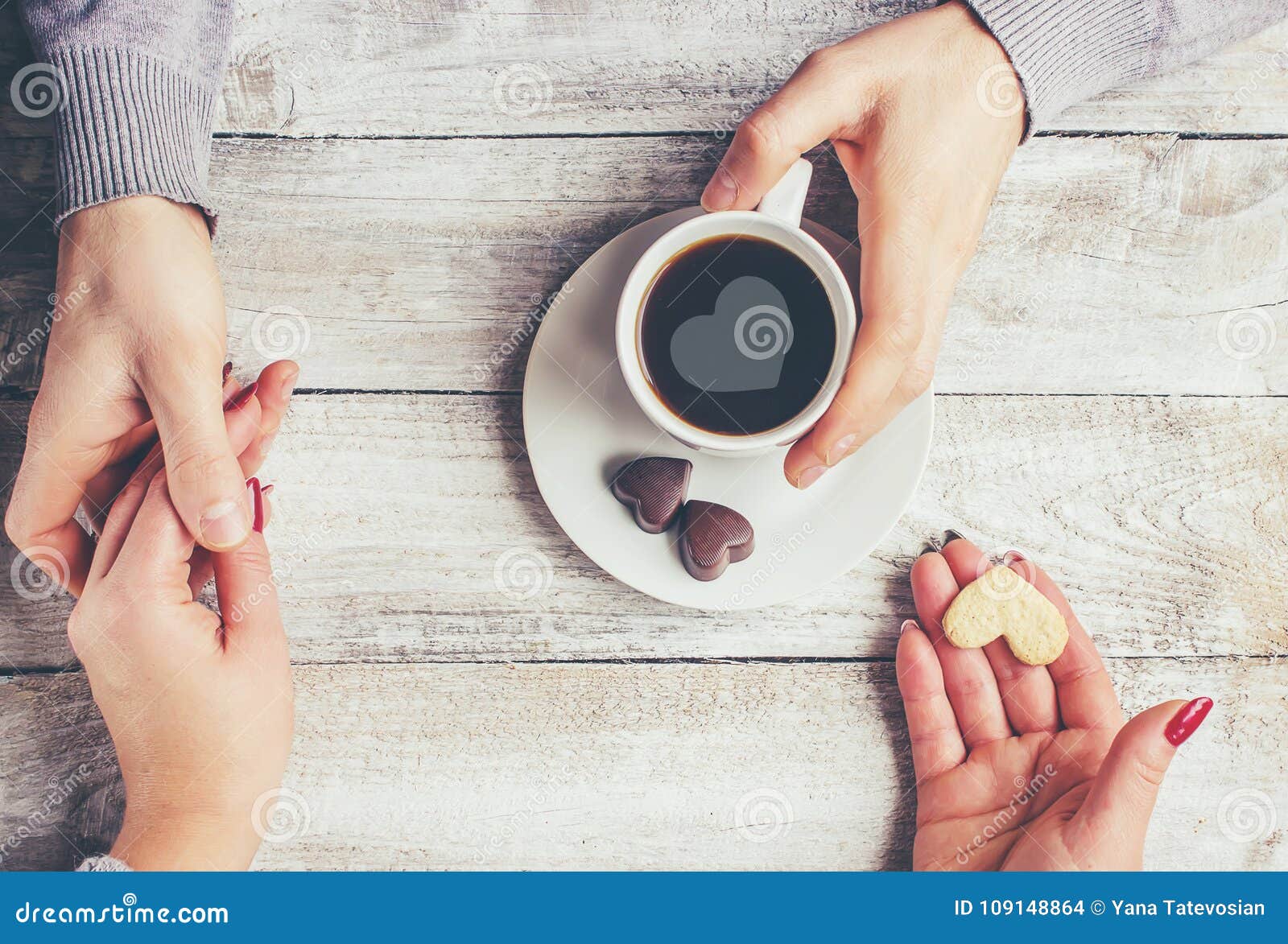 A Cup of Coffee in the Hands of Lovers. Silhouette in a Cup Stock Photo ...