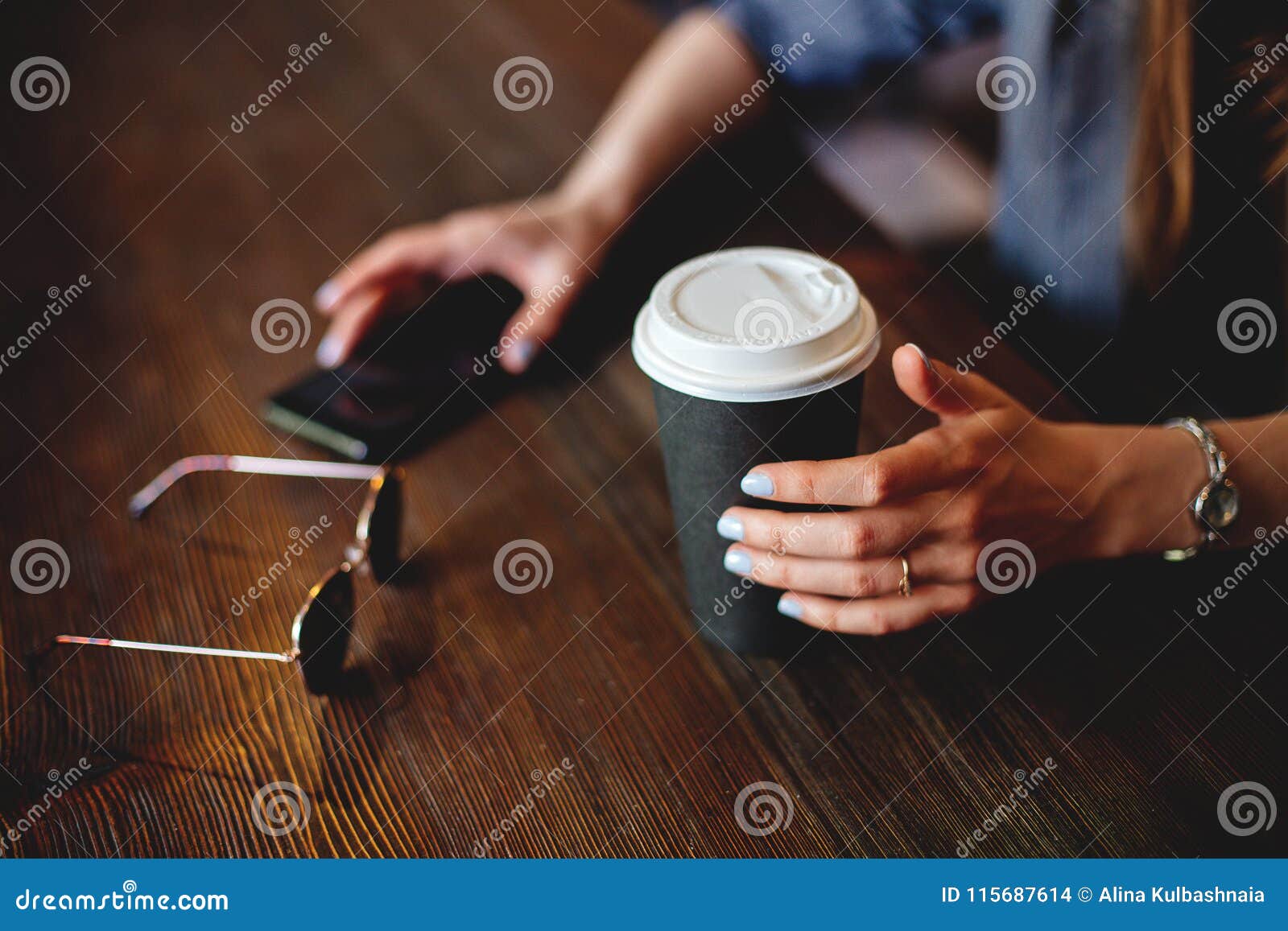 Cup of coffee in hands. stock photo. Image of outdoor - 115687614