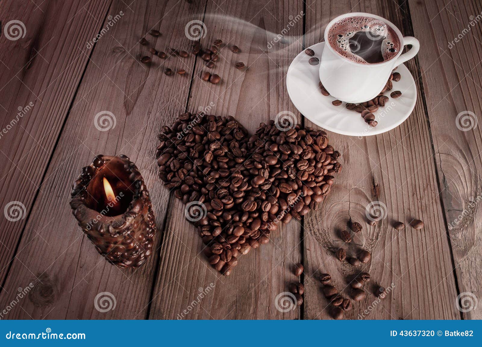 A Cup of Coffee with Heart Shaped Stack of Coffee and Coffe Candle ...