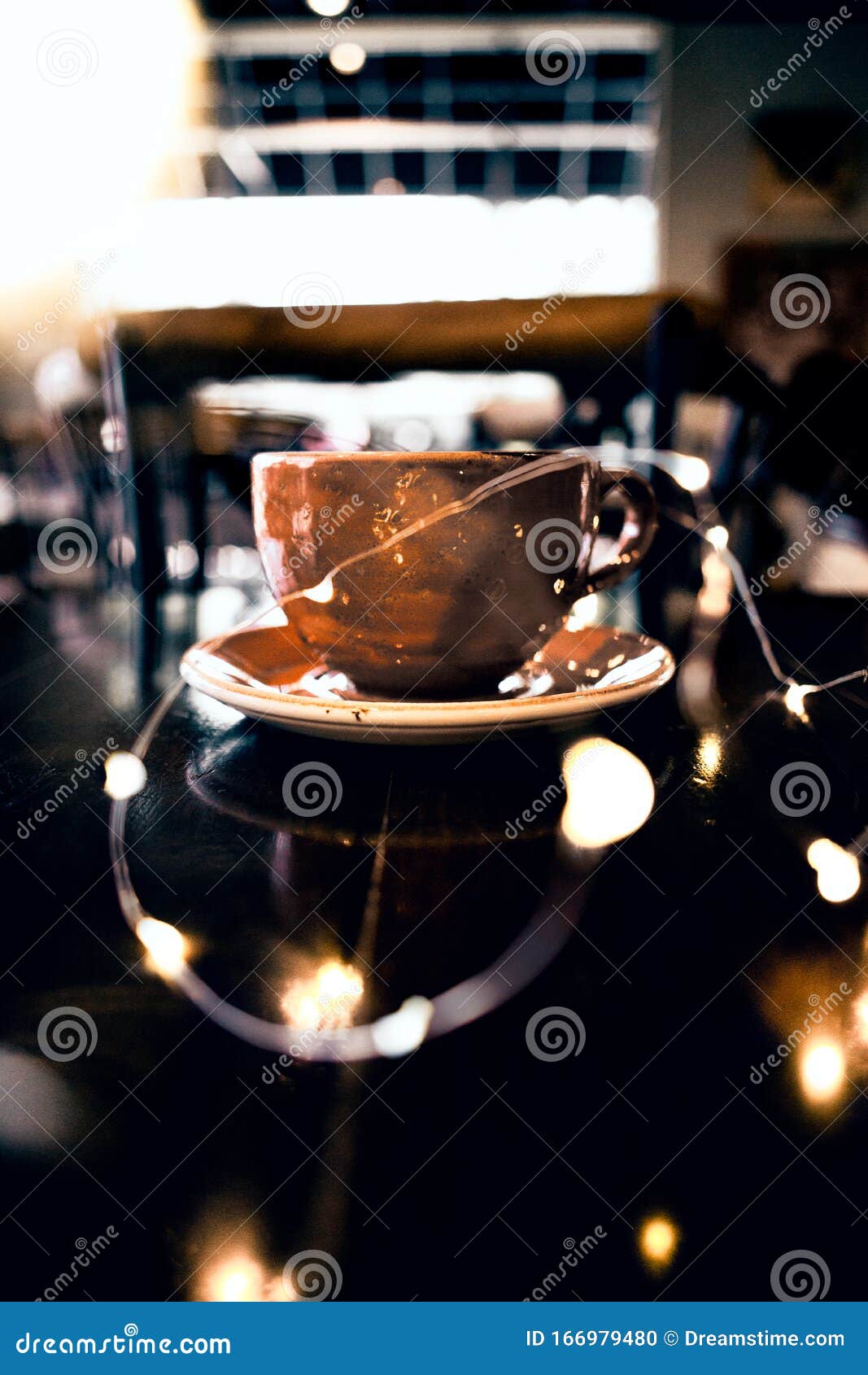 Cup of coffee with lights stock photo. Image of orange - 166979480