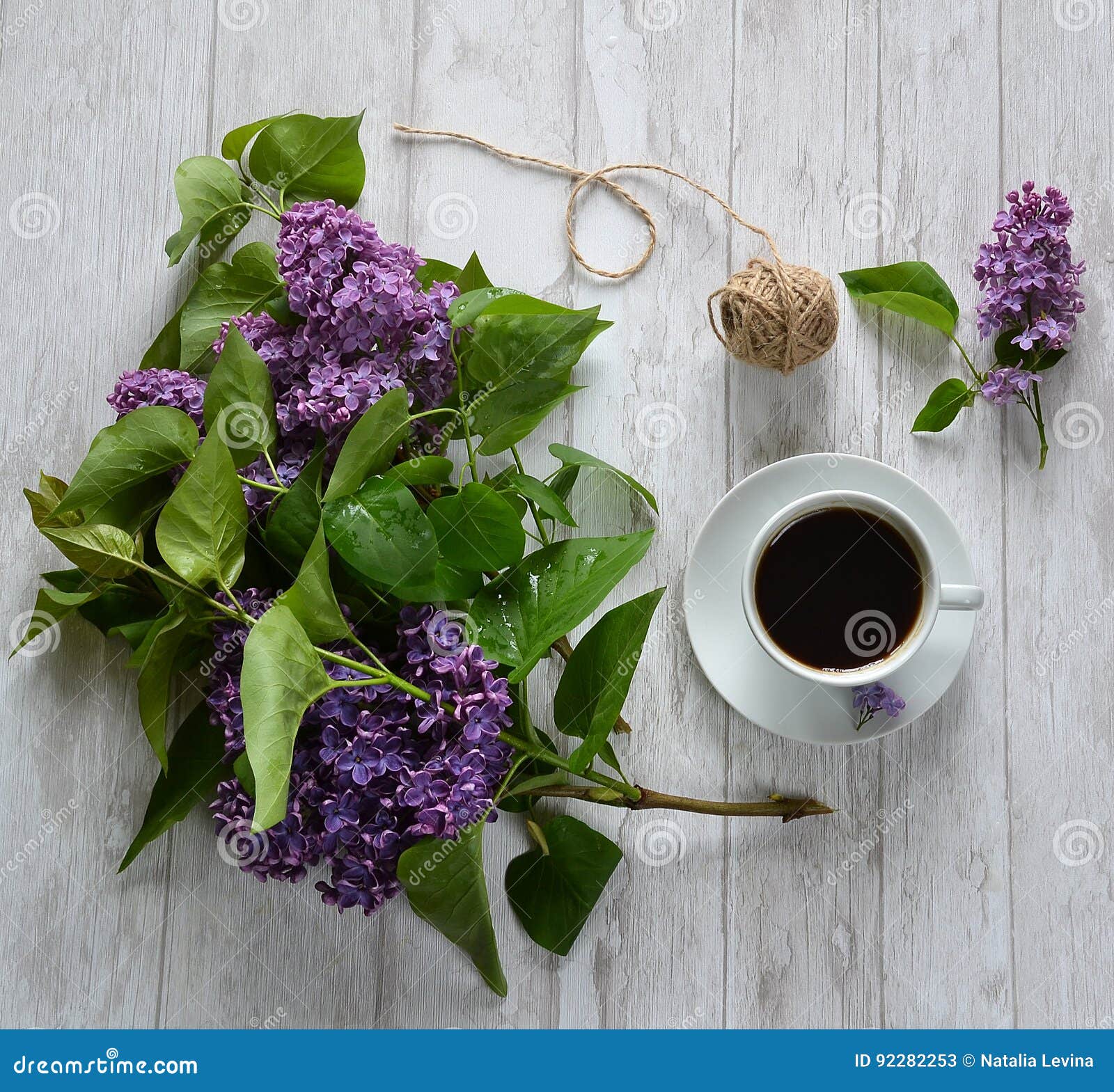 A Cup of Coffee and Lilacs on the Table. Stock Image - Image of ...