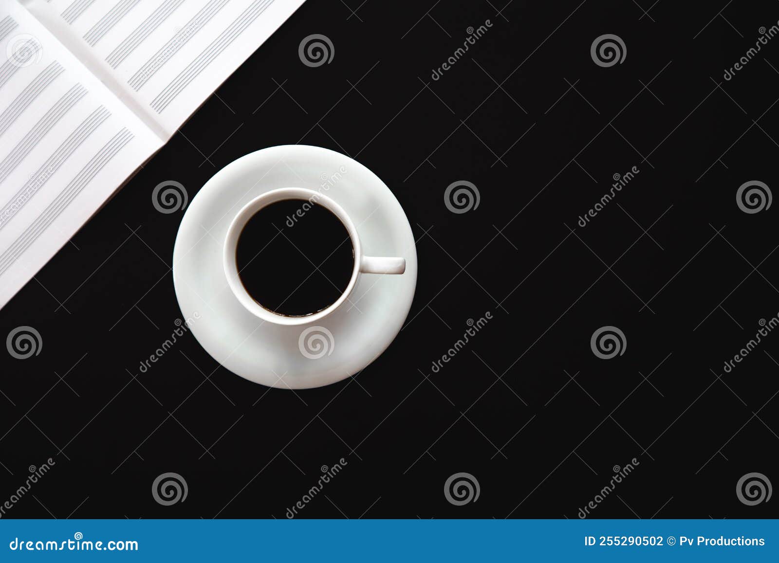 A Cup of Coffee, a Notebook for Writing Notes on a Black Background ...