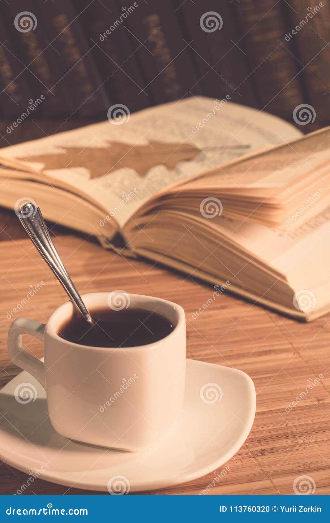 A Cup of Coffee and an Open Book on the Table Stock Photo - Image of ...