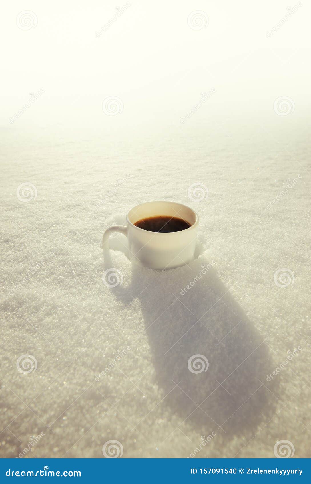 Cup of coffee on the snow stock photo. Image of full - 157091540