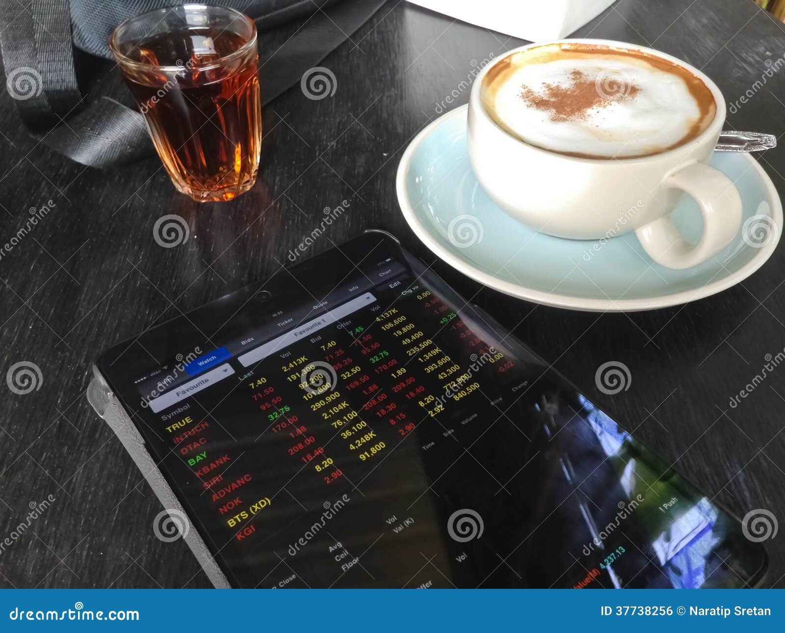 Cup of coffee and tablet editorial photo. Image of beverage - 37738256