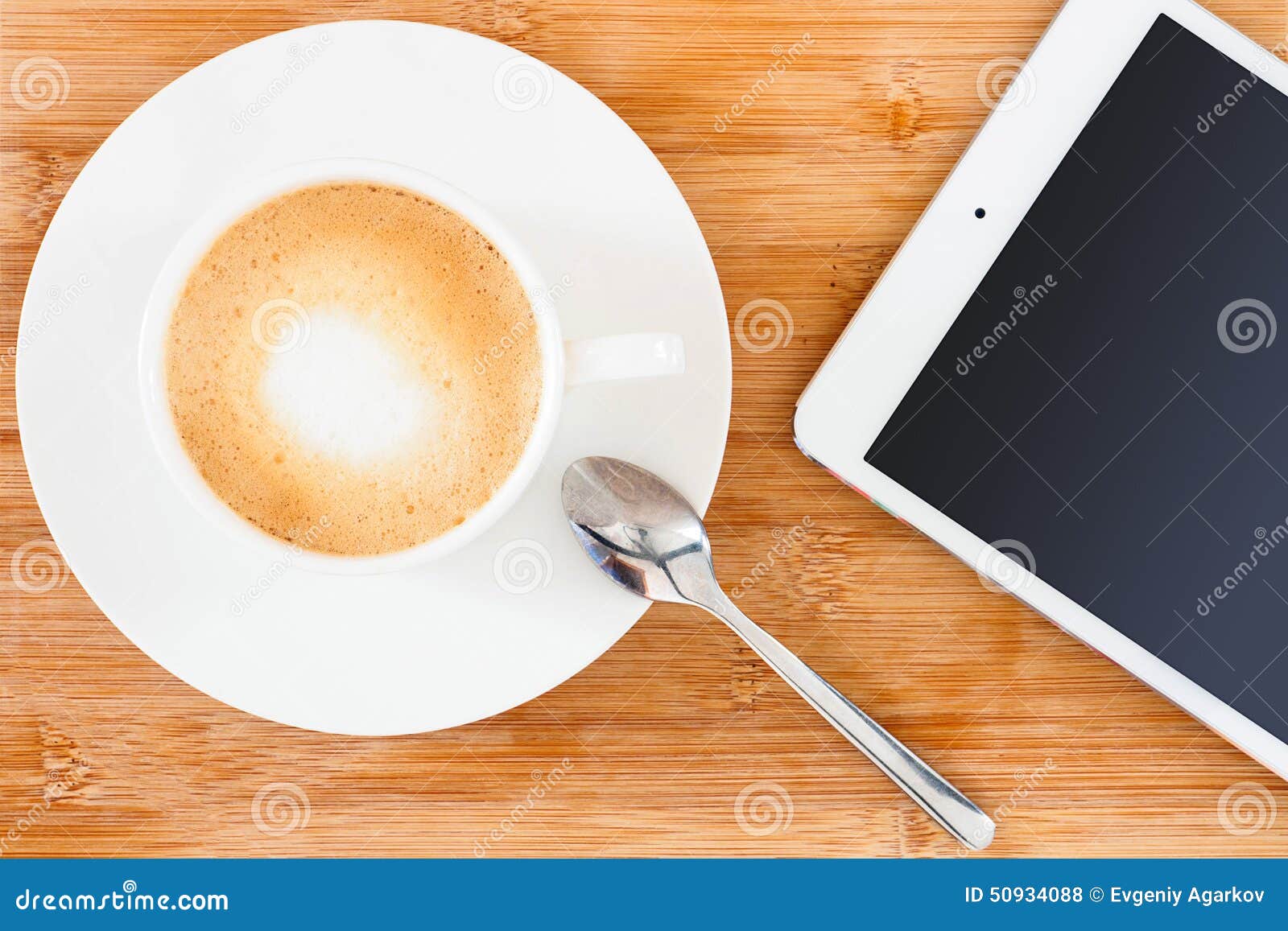 Cup of coffee with tablet stock photo. Image of closeup - 50934088