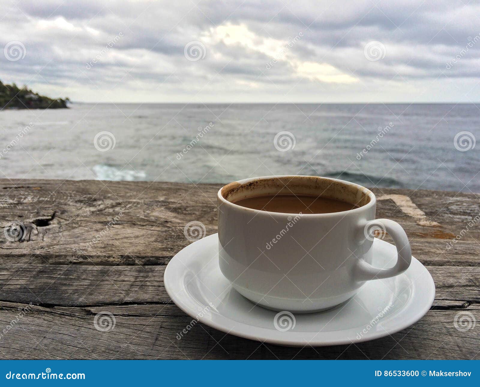 Cup of Coffee on a Wooden Table with an Ocean View Stock Photo - Image ...