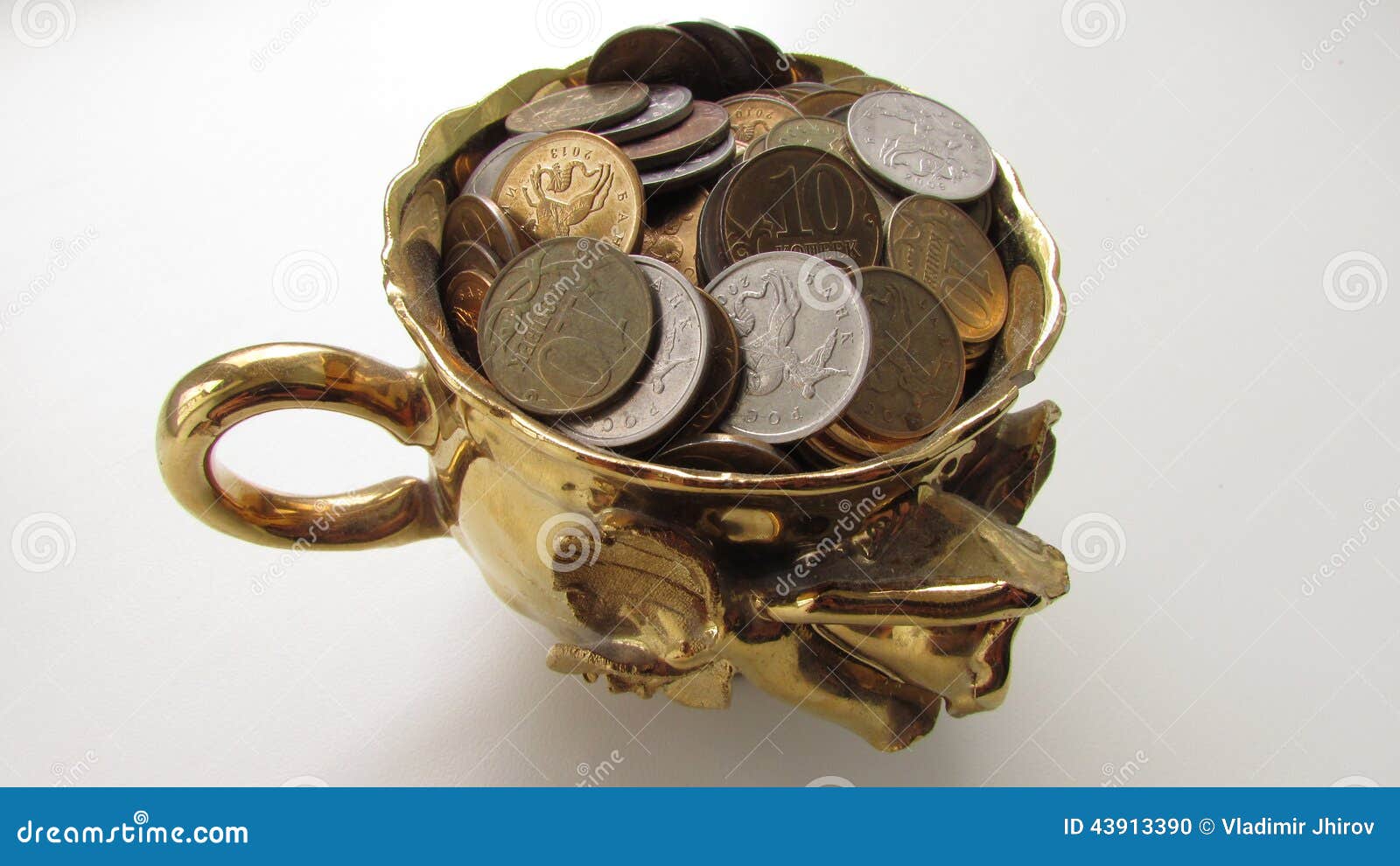 Cup with coins stock photo. Image of rocks, beach, lake - 43913390