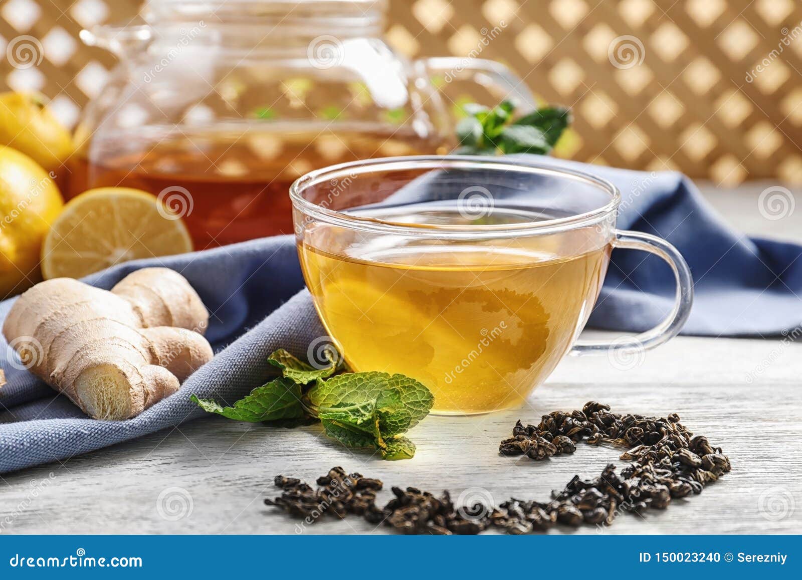 Cup of Delicious Tea with Mint, Ginger and Lemon on Table Stock Photo ...