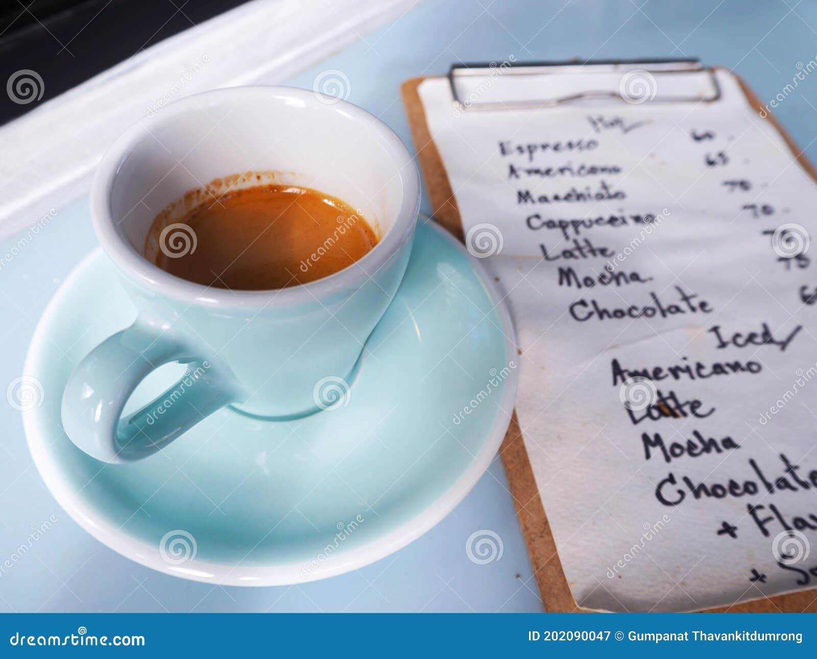 Cup of Espresso Coffee Ready To Serve with Coffee Menu on the Blue ...
