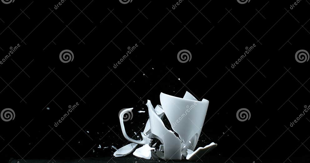 Cup Falling and Exploding on Black Background Stock Image - Image of ...