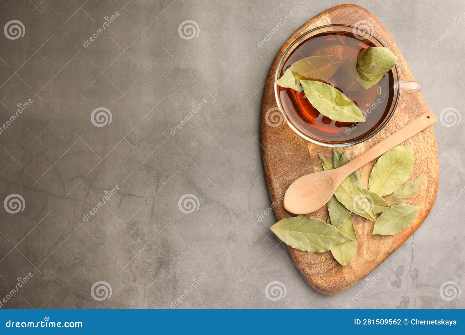 Cup of Freshly Brewed Tea with Bay Leaves on Grey Table, Top View ...