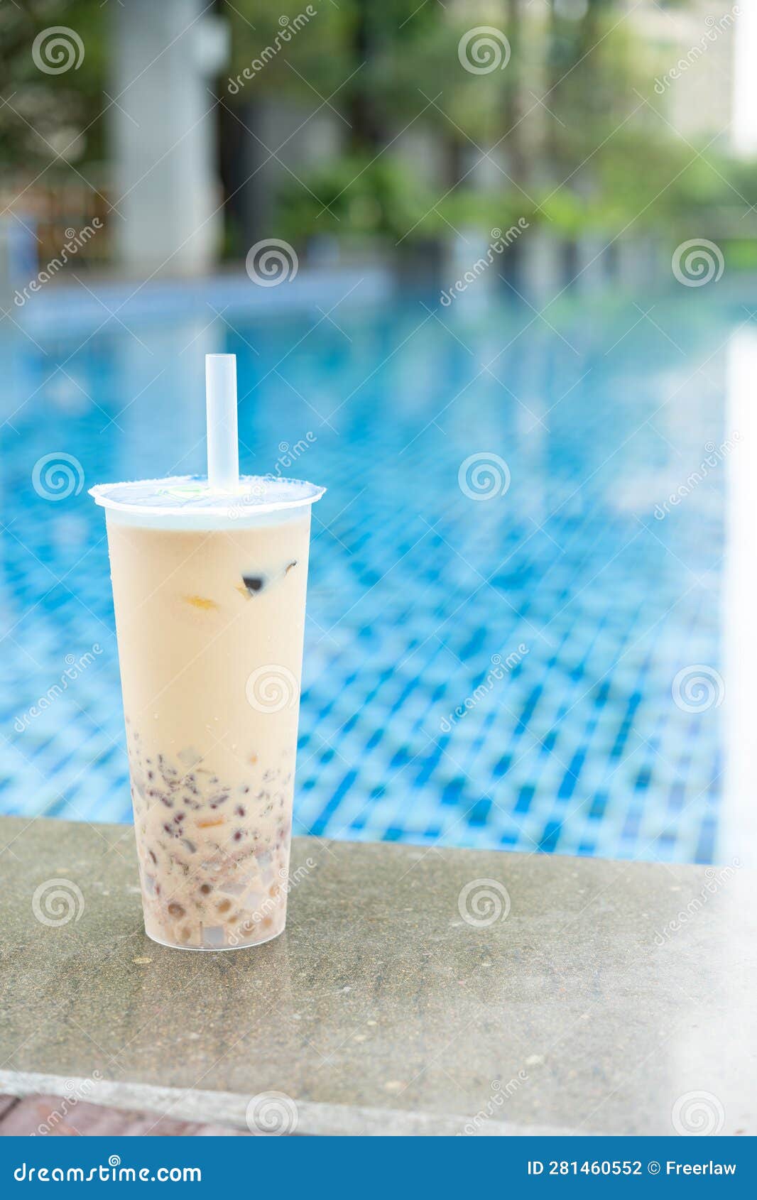 A Cup of Grass Jelly Near a Swimming Pool at Vertical Composition Stock ...