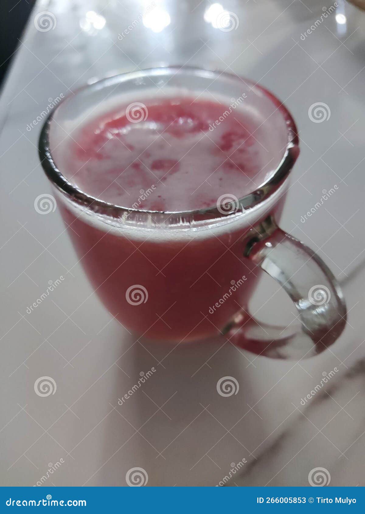 A cup of guava juice stock image. Image of citrus, yellow - 266005853