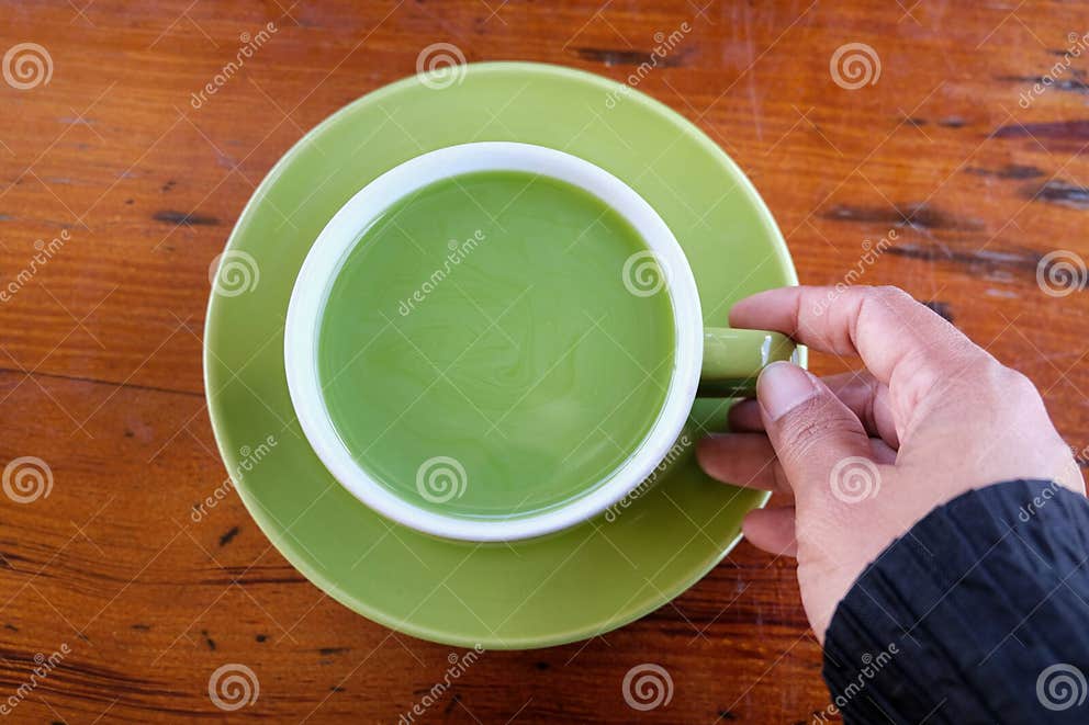 Cup of Hot Milk Green Tea in Hand Stock Photo - Image of elements, herb ...