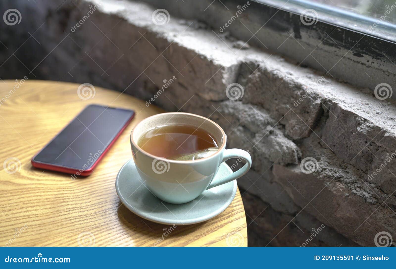 Cup of Hot Tea and Cellphone on Wood Table Stock Image - Image of black ...