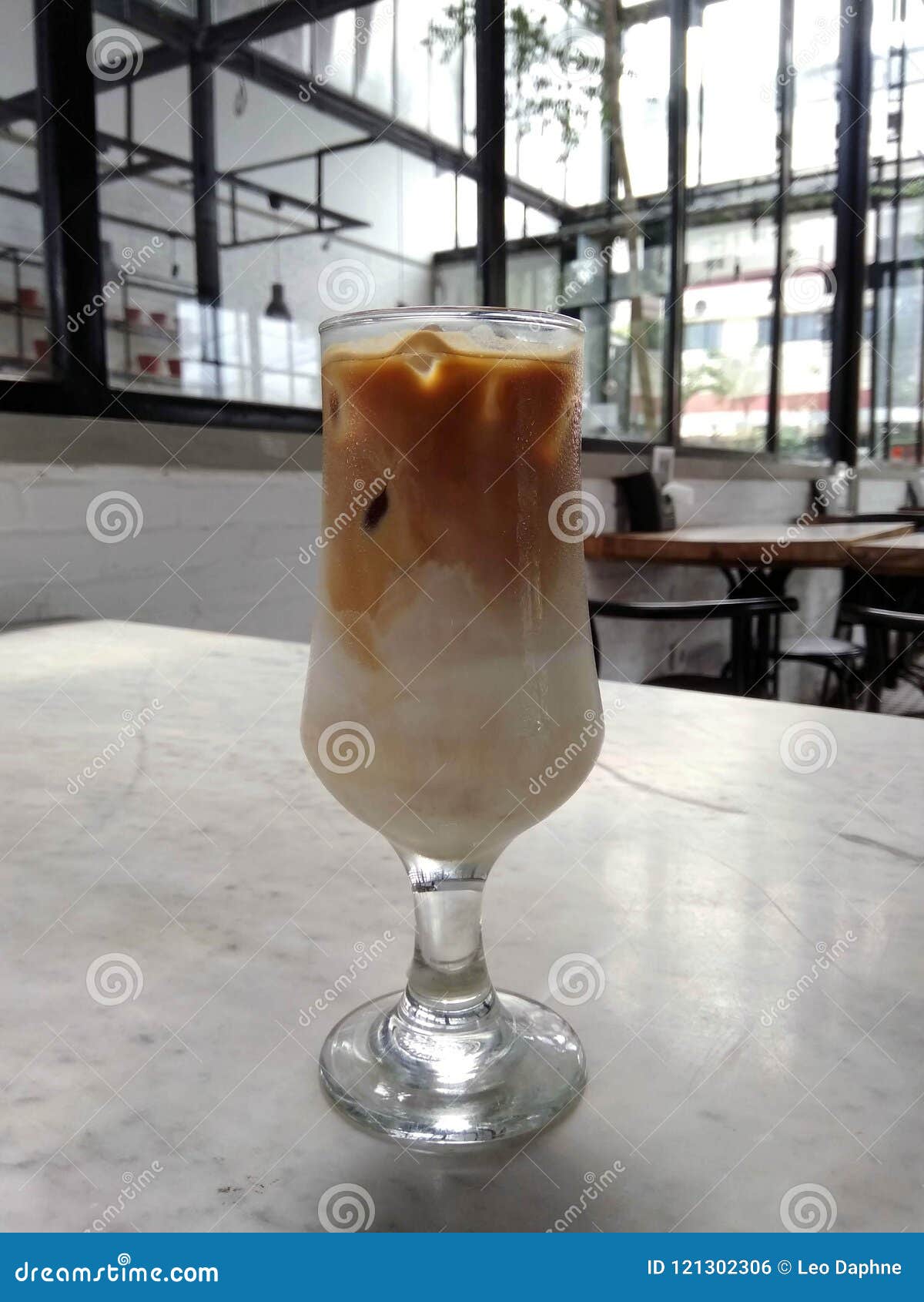 A Cup of Ice Cafe Latte Served Cold Stock Photo - Image of brown ...