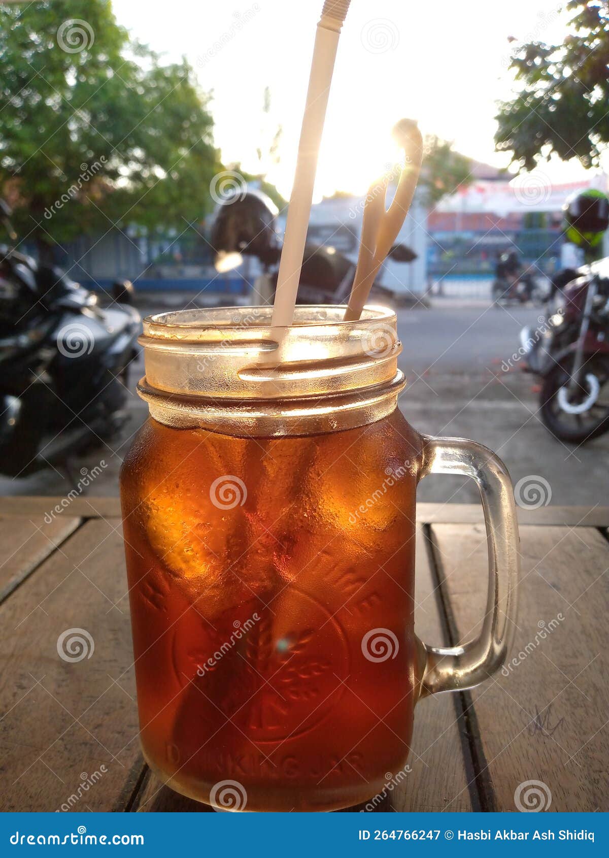 A Cup with Ice Tea in the Sunset Stock Image - Image of drink, sunset ...