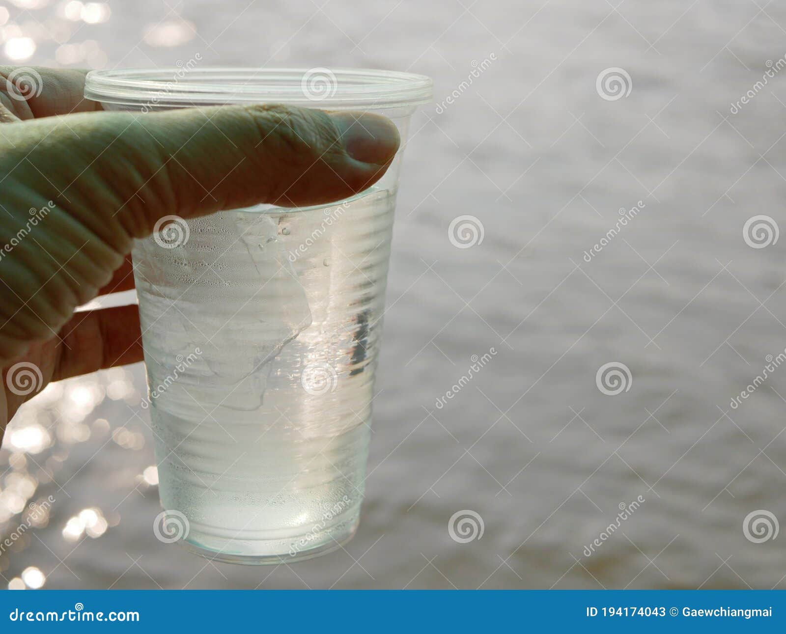 A Cup of Iced Cold Refreshing Drinking Water with Being Held on with ...