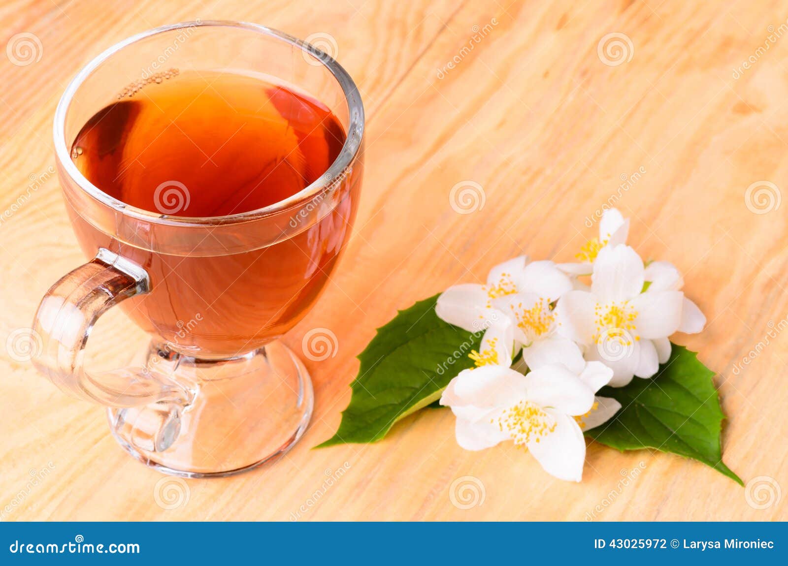Cup of jasmine tea stock photo. Image of wholesome, wooden - 43025972
