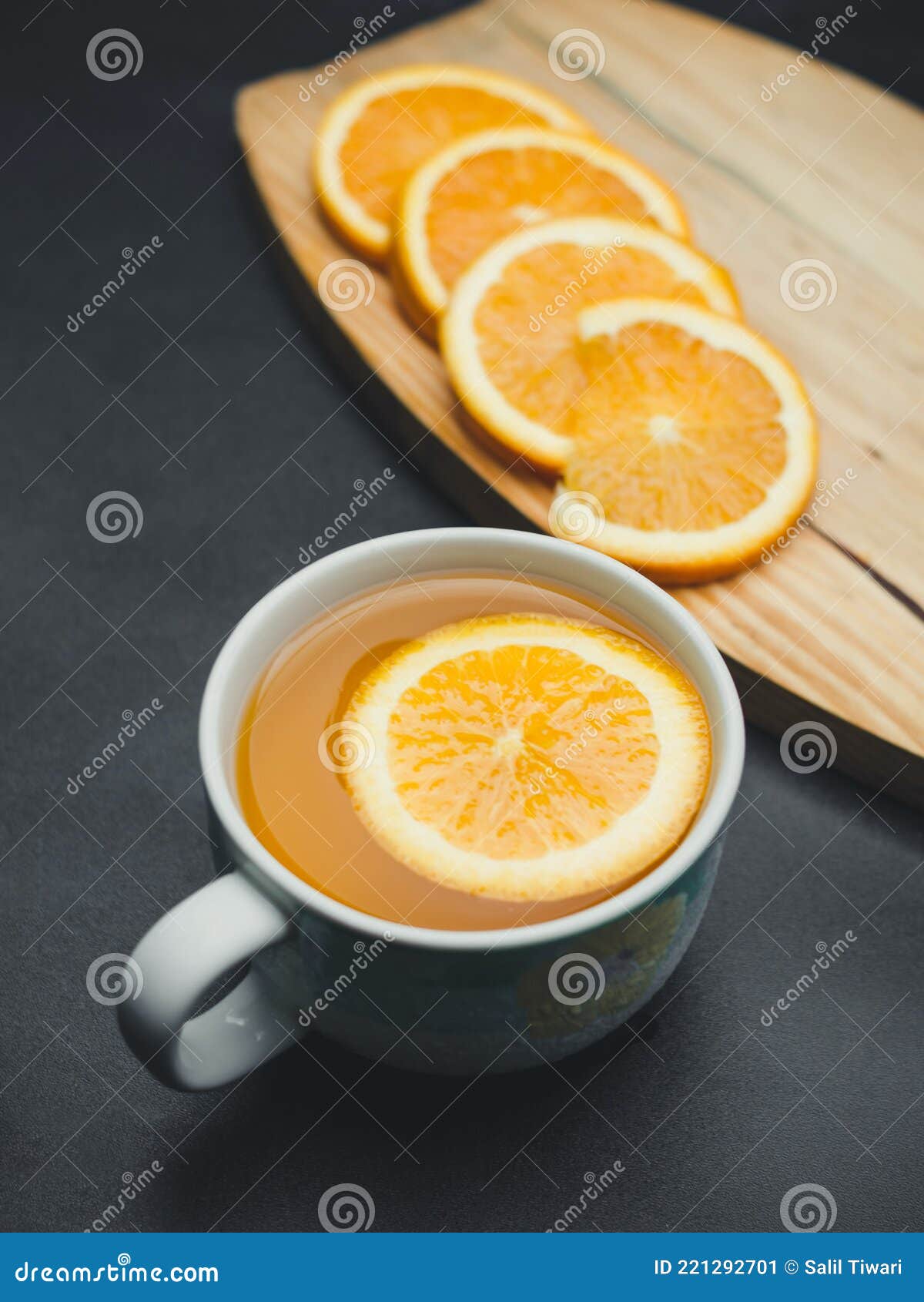 A cup with orange juice stock image. Image of round - 221292701