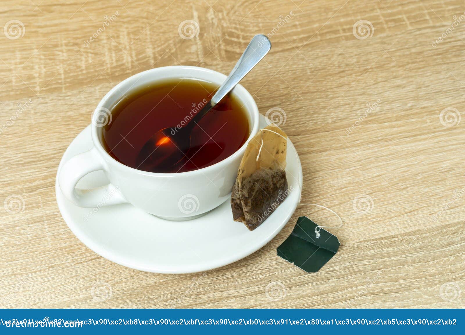 Cup on a Saucer with Tea and a Used Tea Bag Stock Photo - Image of ...