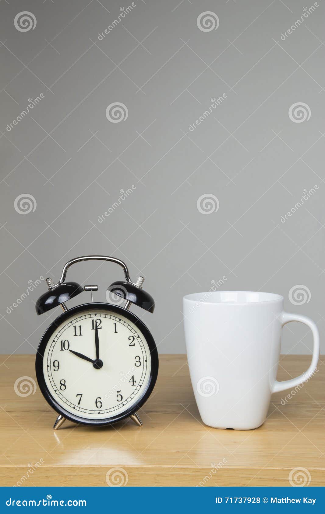 Cup of tea and alarm clock stock photo. Image of desk - 71737928
