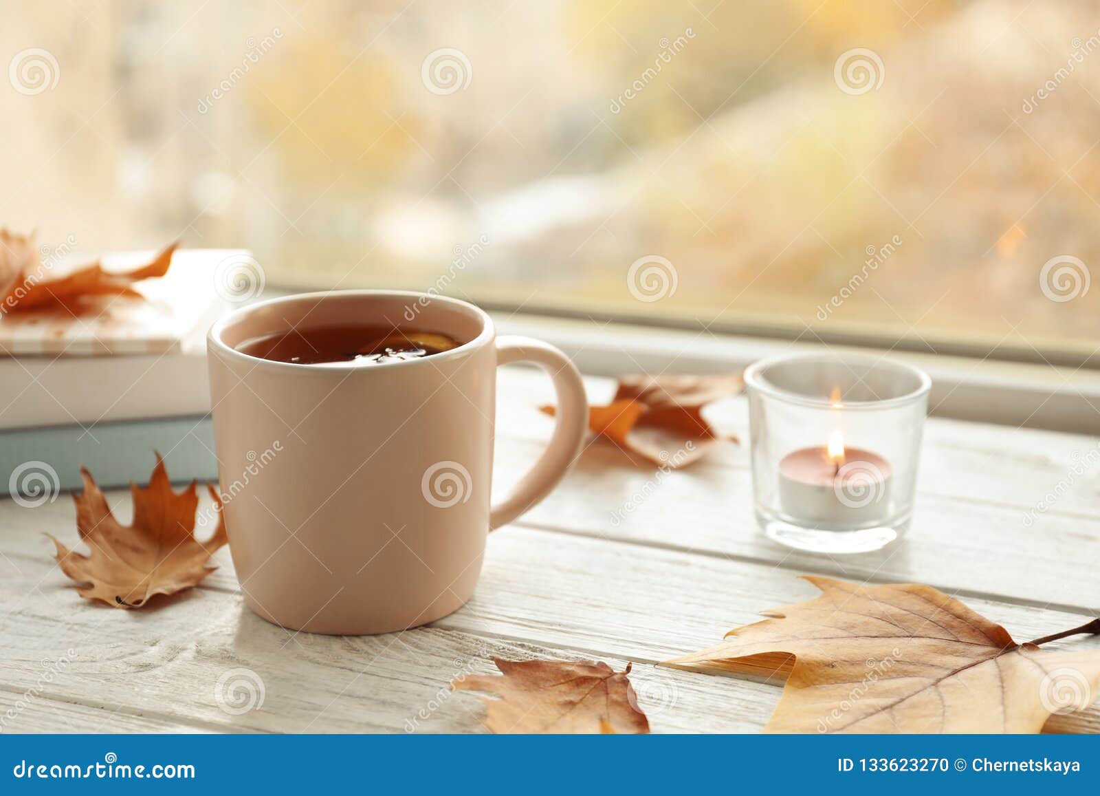 Cup of Tea, Autumn Leaves and Stack of Books Stock Photo - Image of ...