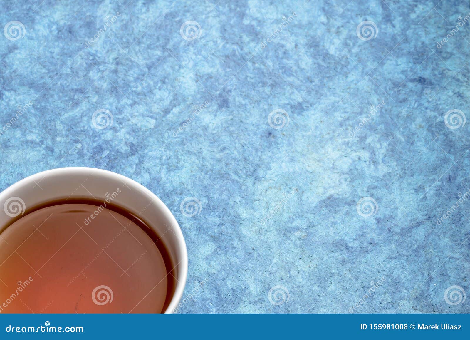 Cup of Tea on a Blue Bark Paper Stock Photo - Image of white, textured ...