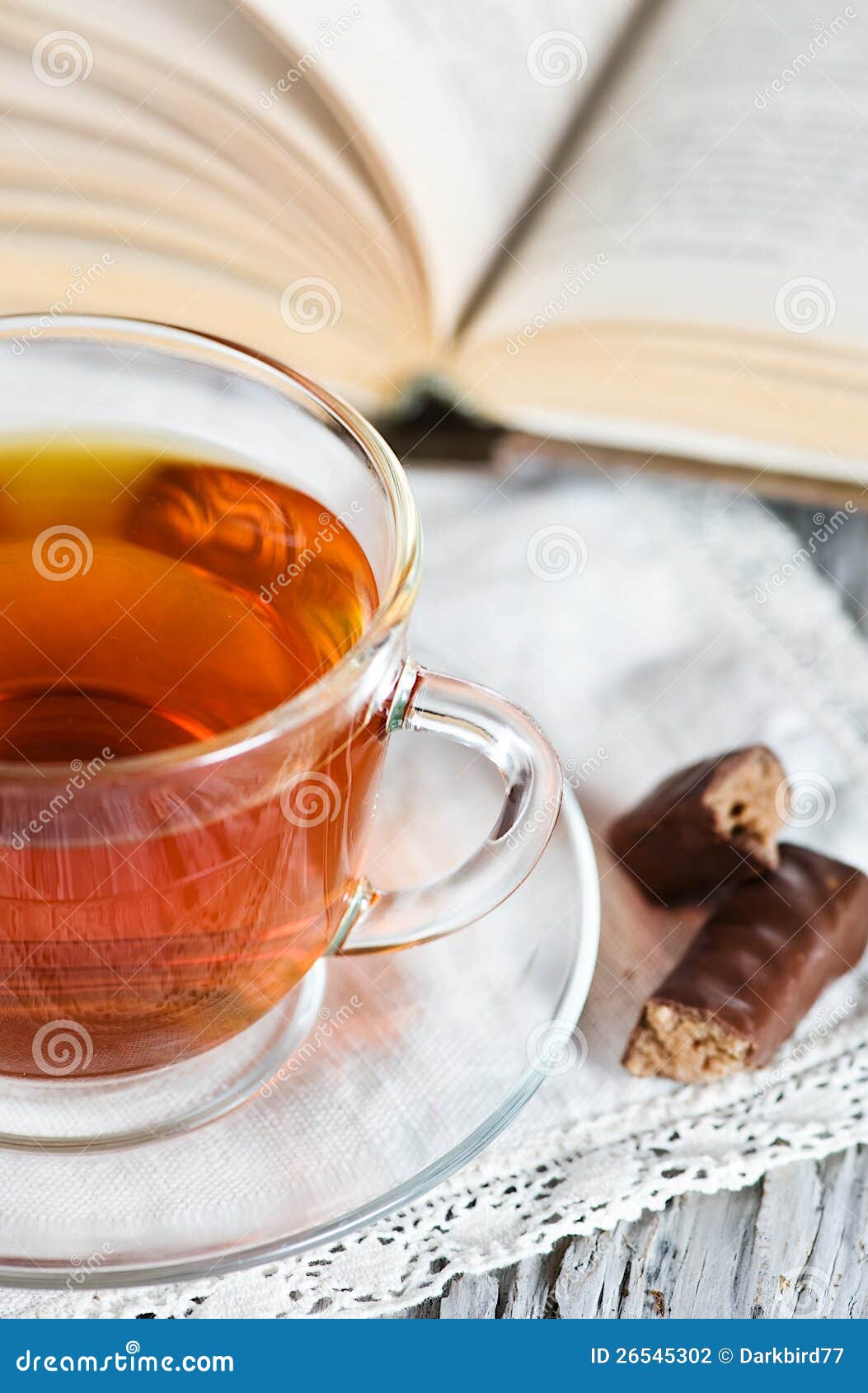 Cup of tea, candy and book stock photo. Image of chocolate - 26545302
